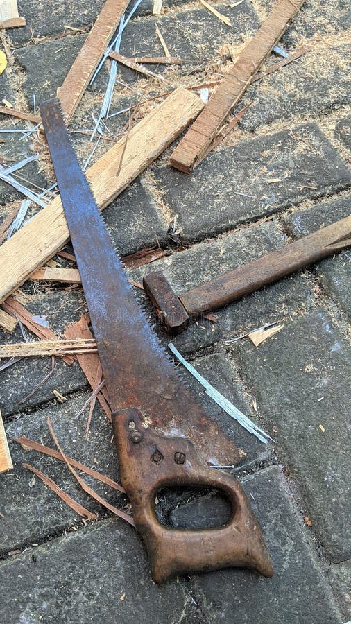 A Saw and Hammer that are so Old they are Rusty Stock Photo - Image of ...