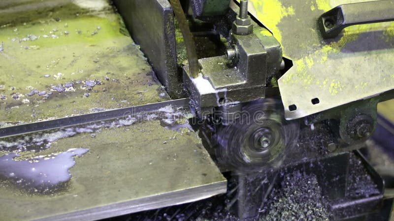 Sawing a Metal Plate on the Cutting Line Flying Chips Dripping Drops ...