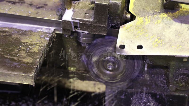 Sawing a Metal Plate on the Cutting Line Flying Chips Dripping Drops ...
