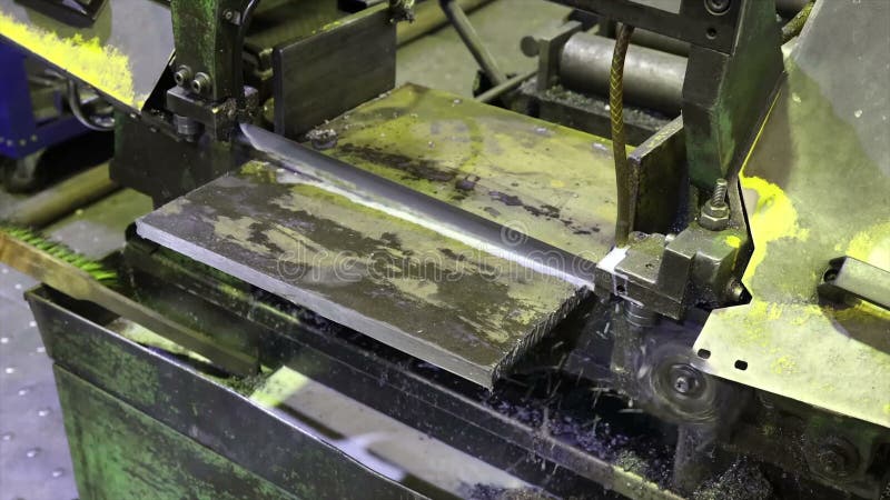 Sawing a Metal Plate on the Cutting Line Flying Chips Dripping Drops ...