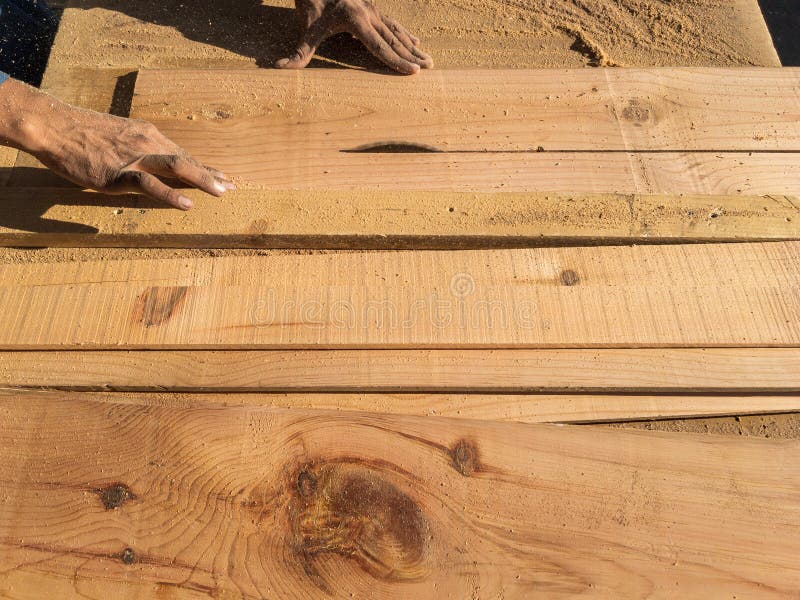 Sawing a Plank of Wood by a Small Sawmill in the Workshop Stock Photo ...