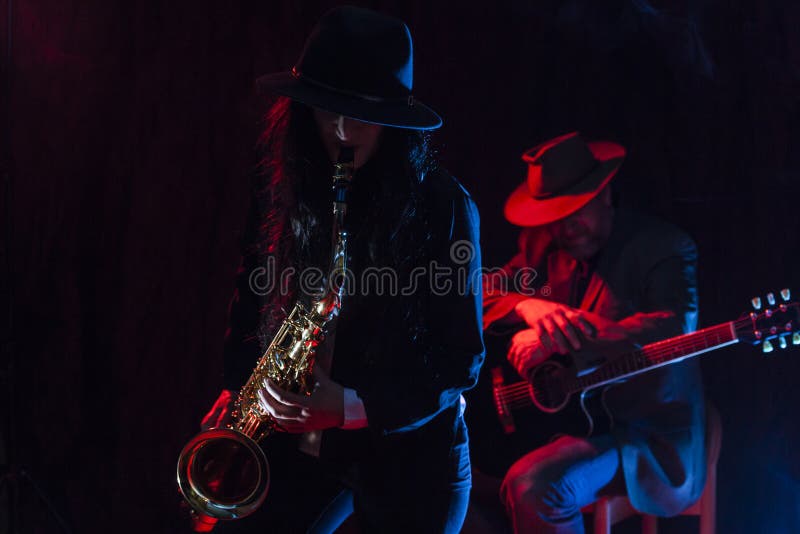 Sax and Guitar stock image. Image of club, beautiful - 54948253