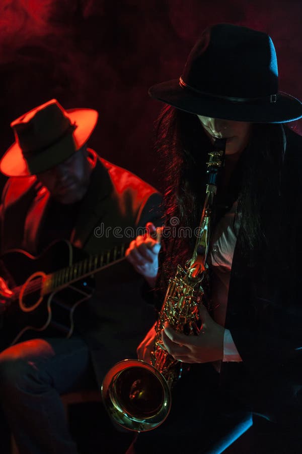 Sax and Guitar stock photo. Image of saxophone, female - 54948622