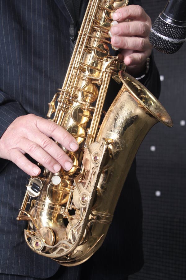 Beautiful Saxophone on Floor Near White Wall Indoors, Space for Text ...