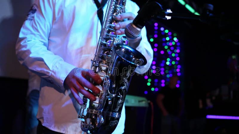 Saxophone in Hands of Musician on Stage in Stock Footage - Video of ...