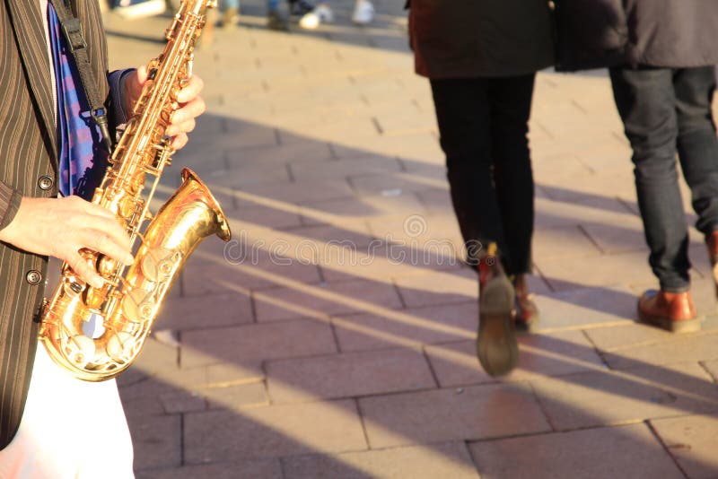 Saxophone Player Busking stock photo. Image of solo - 138299678