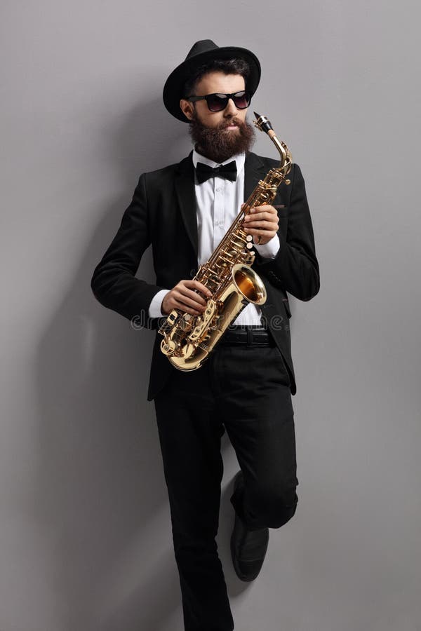 Saxophone Player Leaning Against a Wall Stock Image - Image of jazzer ...