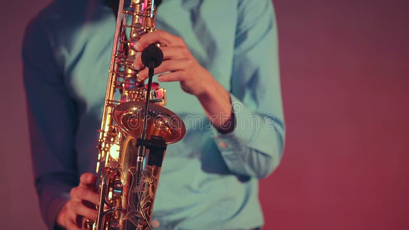 Saxophone Player Performs on Stage with Professional Light. Close Up ...