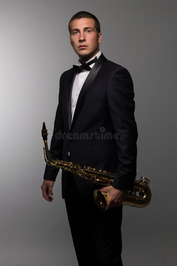 Saxophonist in tuxedo stock photo. Image of black, male - 37943088