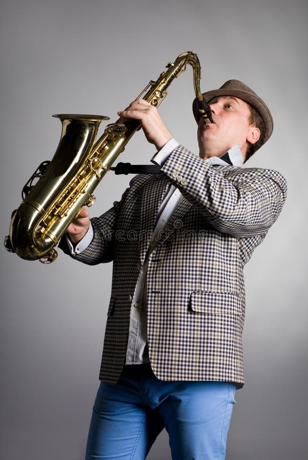 Saxophonist playing stock photo. Image of portrait, person - 22692984