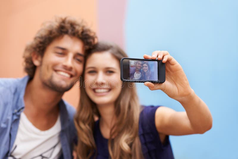 Say Cheese. a Young Couple Taking a Selfie on a Mobile Phone. Stock ...