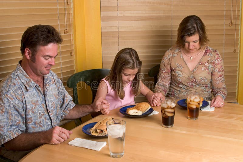 Family Saying Grace 2 stock image. Image of happiness, praying - 191201