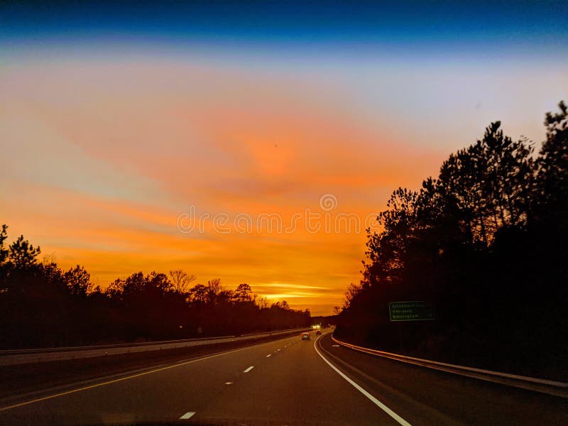 SC sunset on highway One stock photo. Image of sunrise - 211240756