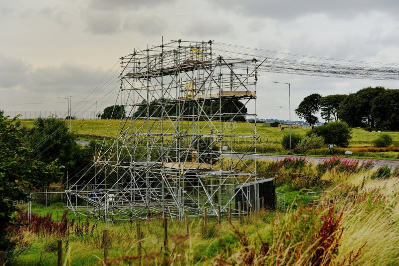 Scaffold tower in a field stock image. Image of cables - 98814189