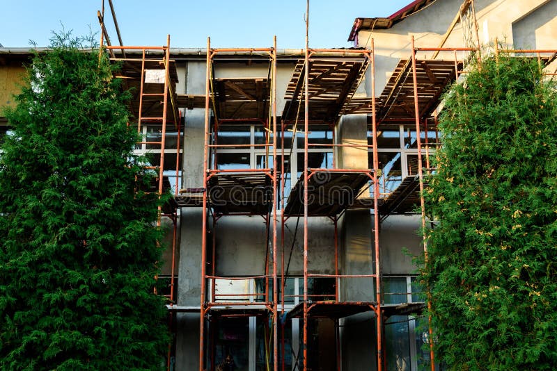 Scaffolding Around a Building. Renovating Facade Stock Image - Image of ...