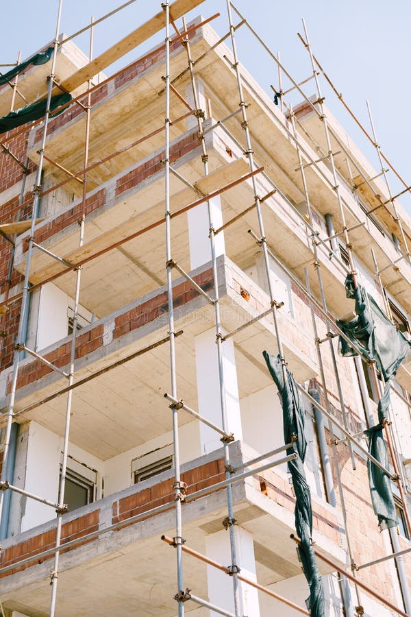 Scaffolding Around the Building Under Construction. Bottom View Stock ...
