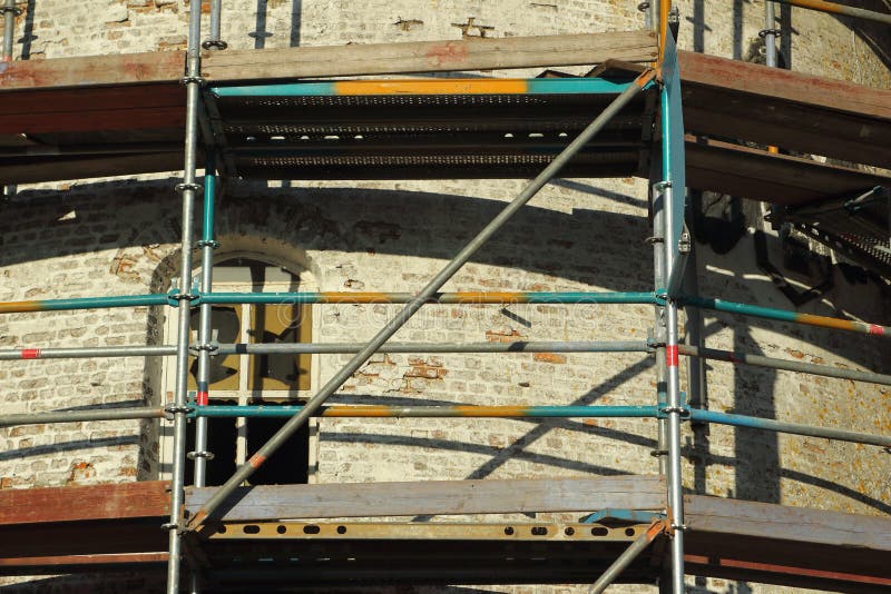 Scaffolding Around an Old Mill for Restoration and Reconstruction Stock ...