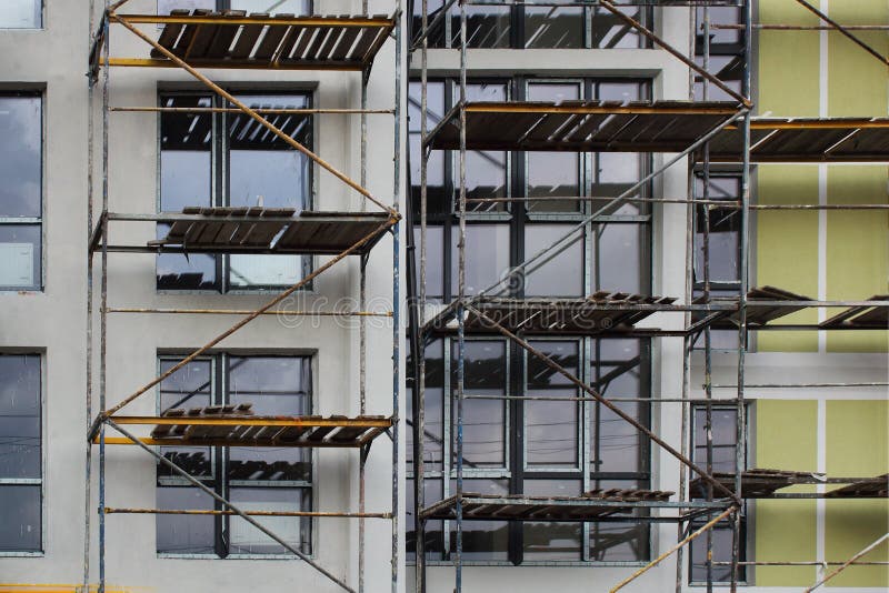 Scaffolding on Building Facadewith Windows. Scaffolding System in ...