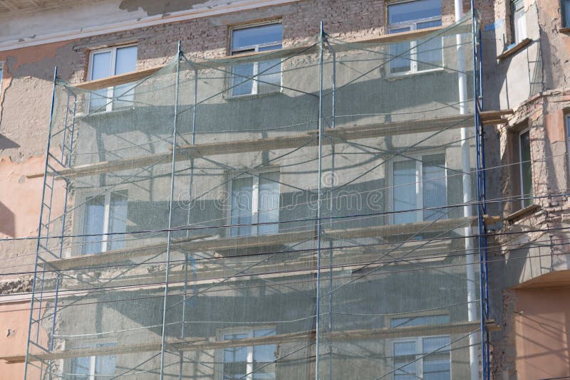 Scaffolding on Building House in the City Stock Photo - Image of work ...