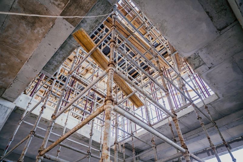 Scaffolding on a Construction Site is Assembled in a Staircase for the ...