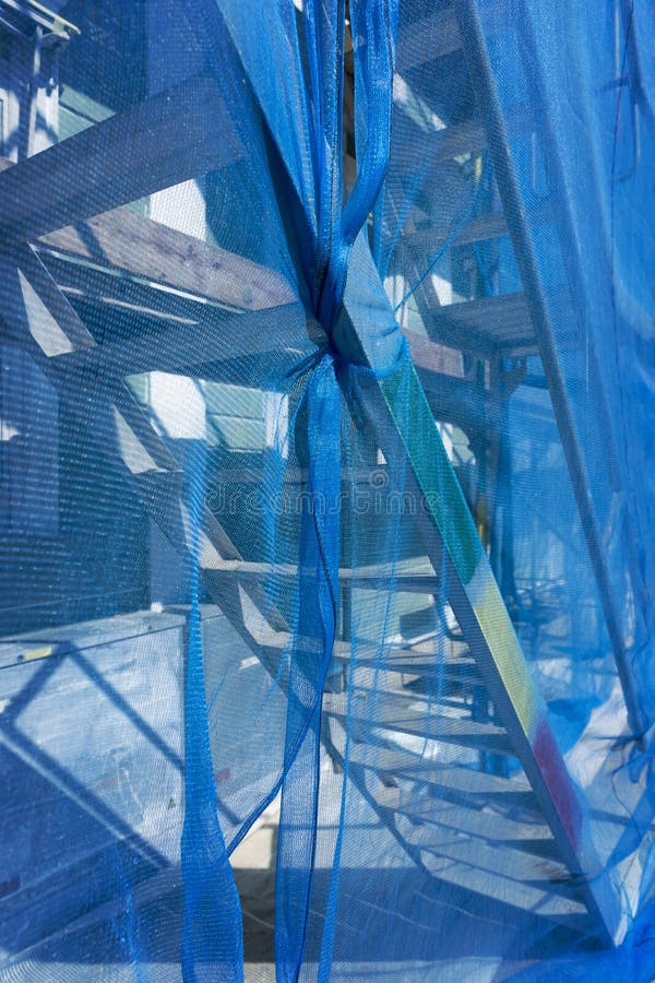Scaffolding with Debris Netting Stock Image - Image of ladder ...