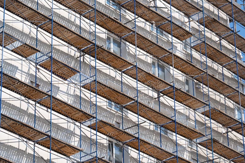 Scaffolding on the Facade of a House Under Construction Stock Photo ...