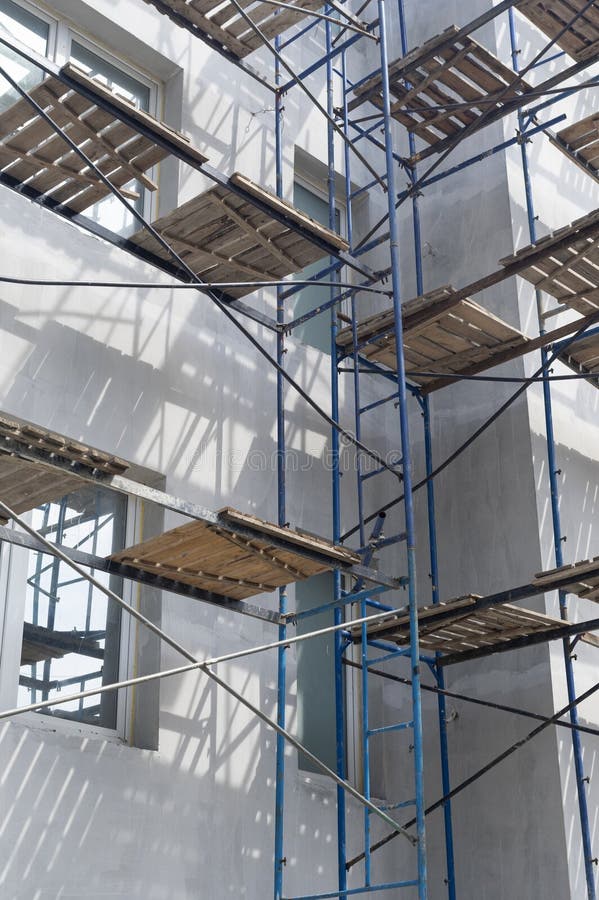 Scaffolding on the Facade of a House Under Construction Stock Photo ...