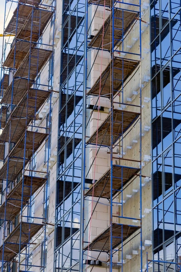 Scaffolding on the Facade of a House Under Construction Stock Image ...
