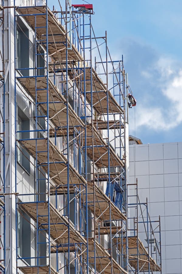 Scaffolding on the Facade of a House Under Construction Stock Photo ...