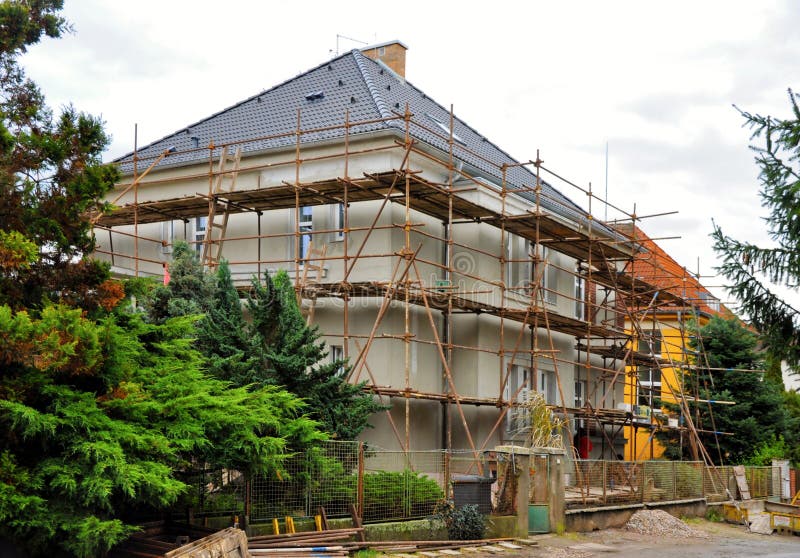 Scaffolding on the house stock photo. Image of blue, houses - 35566210