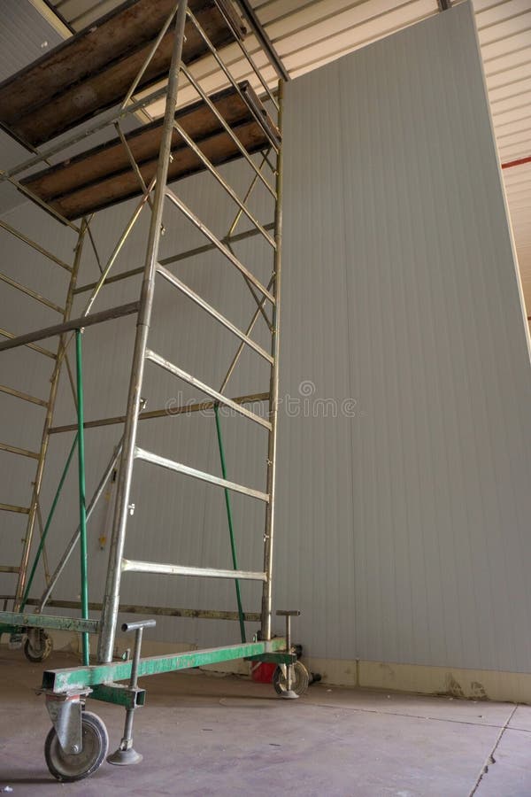 Scaffolding. Mobile Metal Scaffolding on Small Wheels Stock Image ...