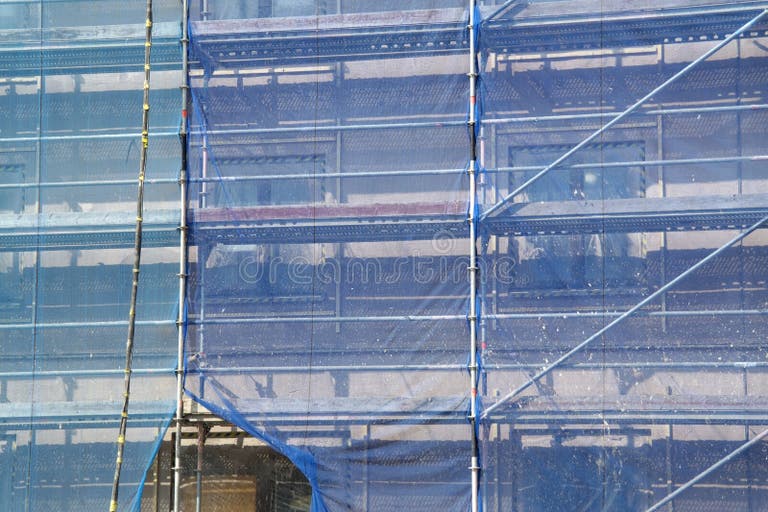 Scaffolding and Netting in a Construction Site Stock Photo - Image of ...
