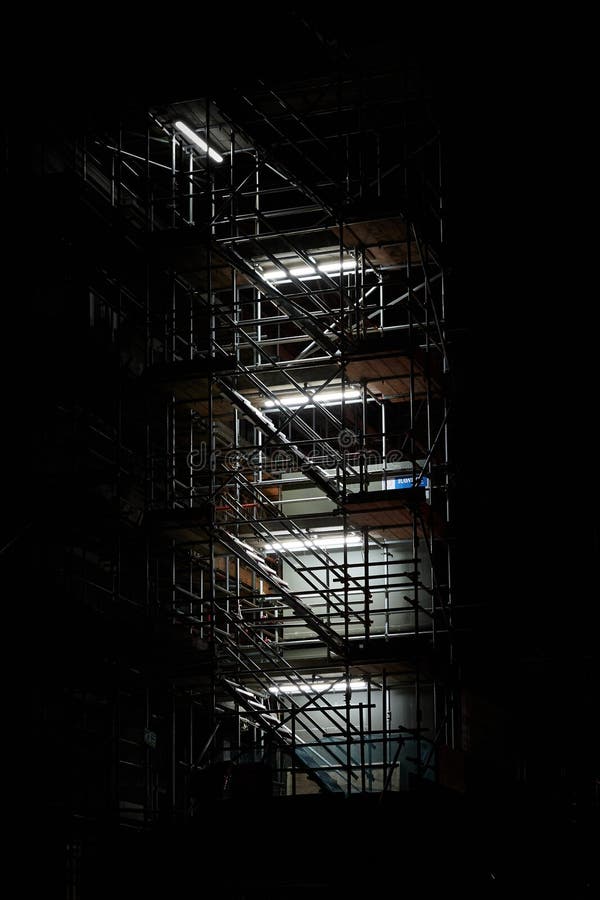 Scaffolding at night stock photo. Image of black, diagonal - 210933774