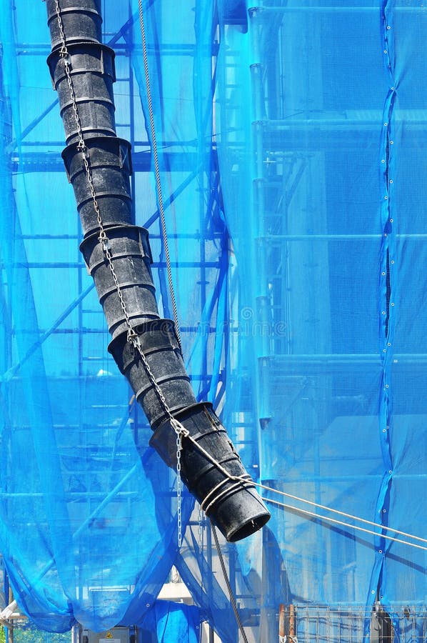 Construction Waste Chute stock photo. Image of scaffolding - 105388