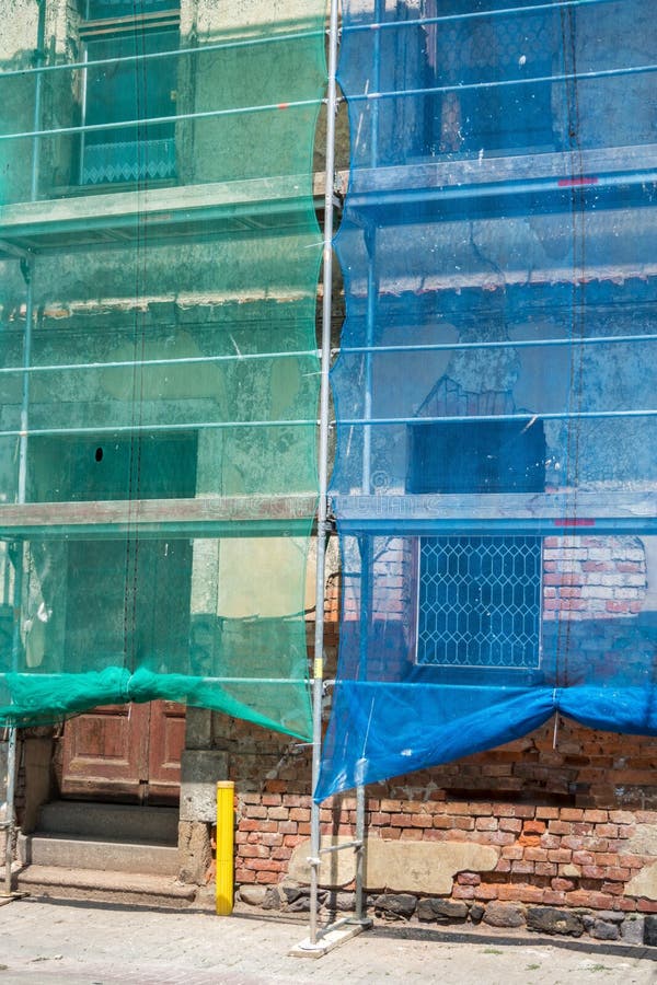 Scaffolding with Safety Net House Stock Photo - Image of scaffolding ...