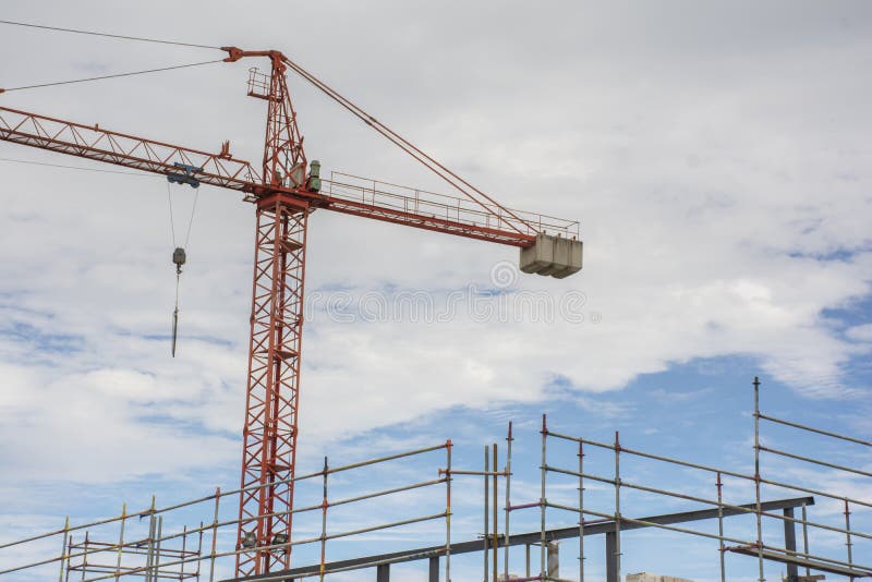 Scaffolding Structure and a Crane at a Construction Site Stock Photo ...