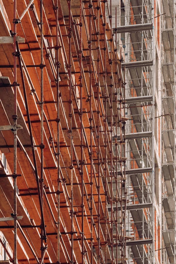 Scaffolding Surrounding a High-rise Building, Low Angle View Stock ...