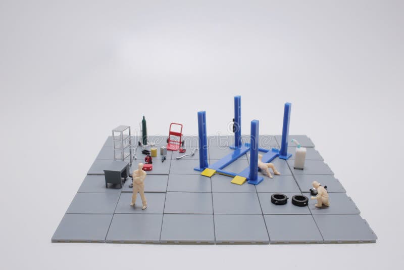 A Scale of Car Mechanic Working at Automotive Service Center Stock ...