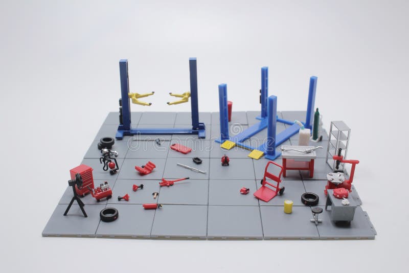 A Scale of Car Mechanic Working at Automotive Service Center Stock ...