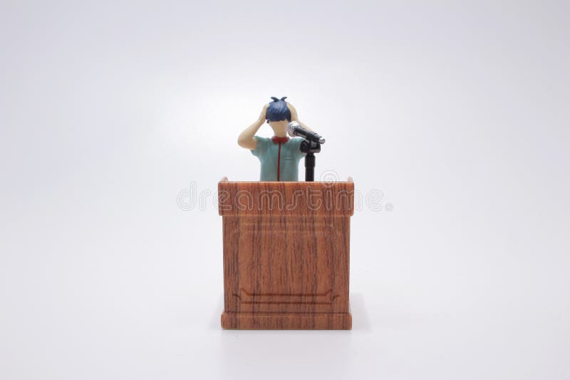 A Scale of Figure Man at Testifying with Desk Stock Image - Image of ...