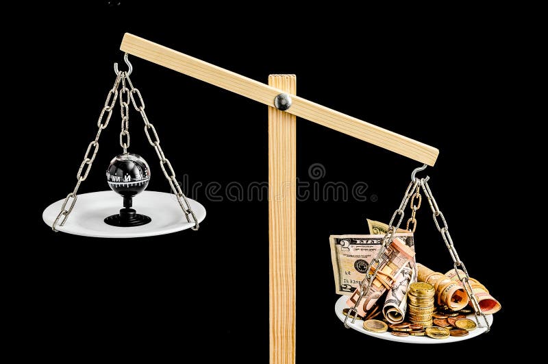 A Scale with a Globe on One Side and Money on the Other Stock Photo ...