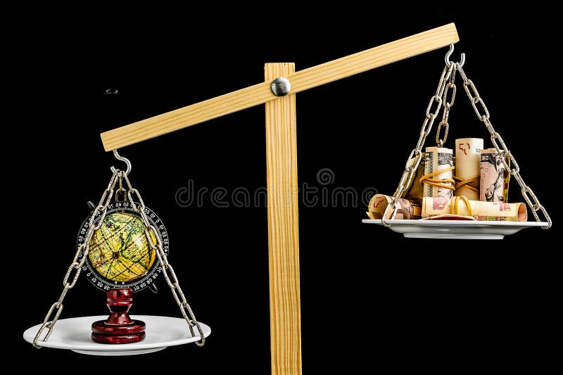 A Scale with a Globe on One Side and a Stack of Money on the Other ...