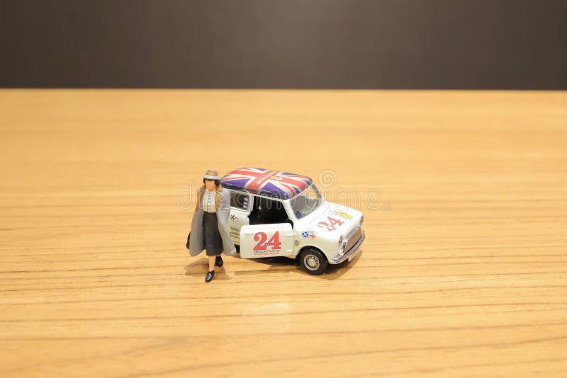 The Scale of Mini Cooper with Figure Editorial Photography - Image of ...