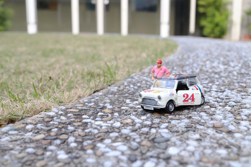 A Scale of Mini Cooper with Figure Editorial Stock Image - Image of ...
