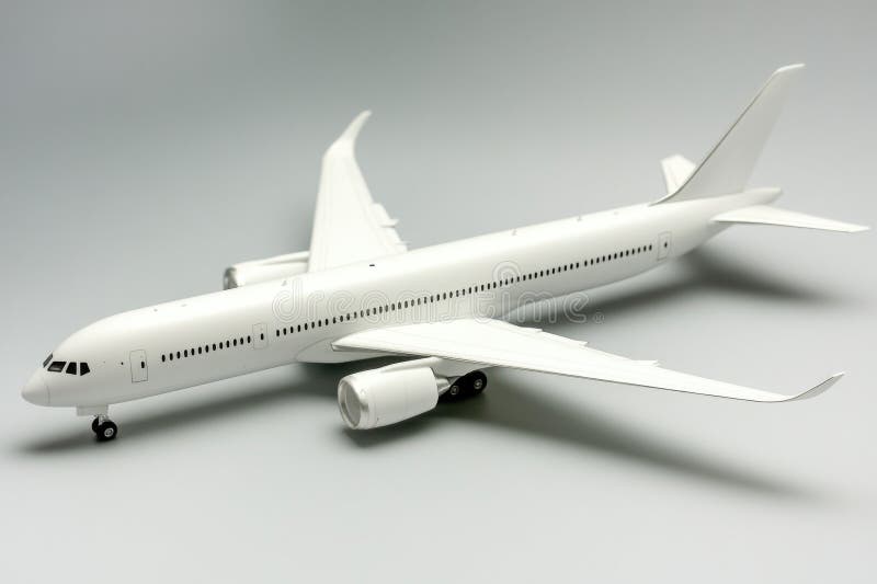 A Scale Model of an Airplane Sitting on a Table, Ideal for Offices or ...