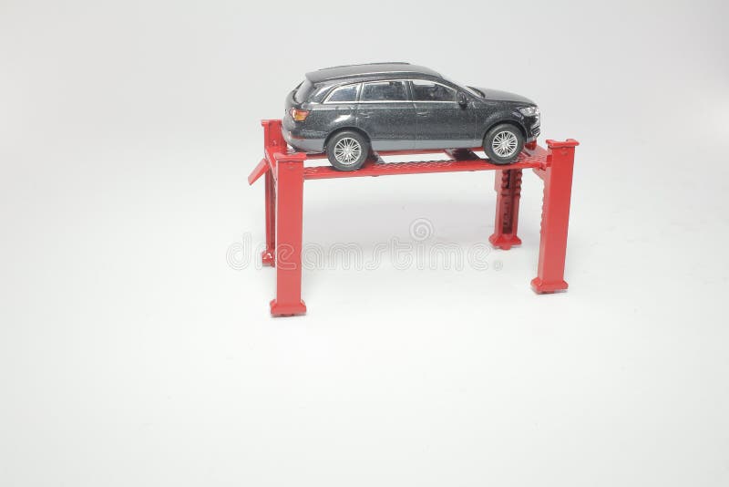 A Scale Tiny of Model Car Lift Stock Image - Image of lifting, help ...