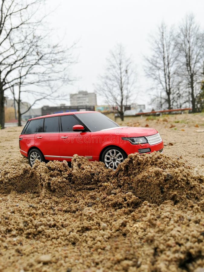Scaled Plastic Model Car on the Sandy Playground Outside Stock Photo ...
