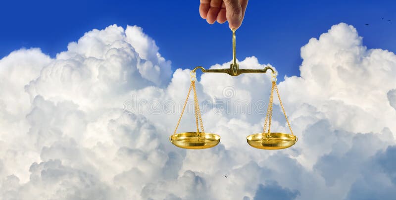 Scales Held by a Person Against a Backdrop of White Clouds and a Blue ...