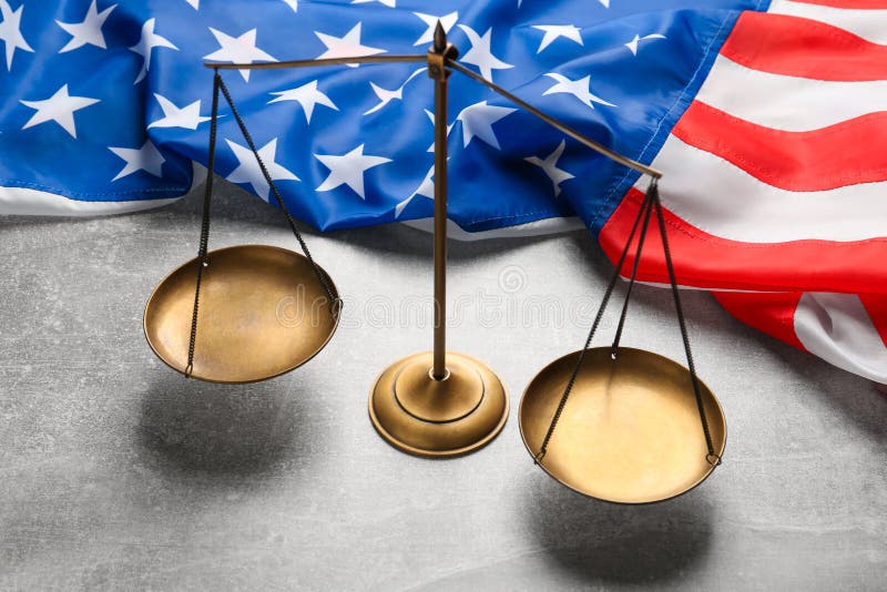 Scales of Justice and American Flag on Light Grey Table Stock Image ...