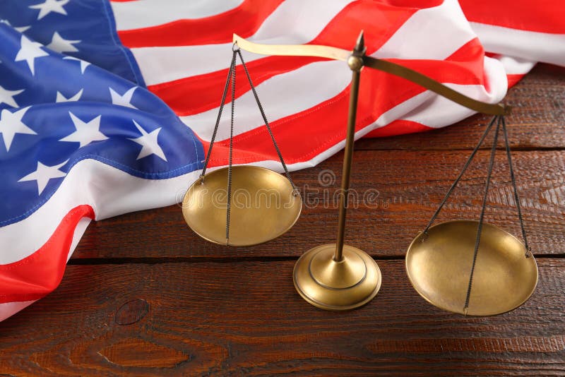Scales of Justice and American Flag on Wooden Table Stock Image - Image ...